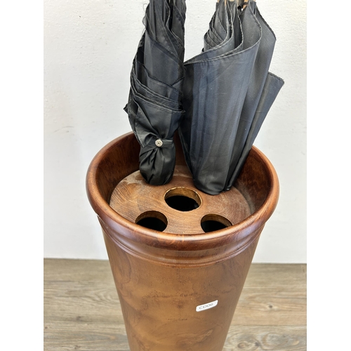 A yew wood cylindrical stick stand with two umbrellas - approx. 59cm ...