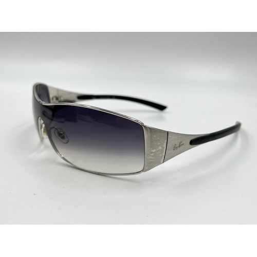 A cased pair of Ray-Ban RB3268 sunglasses