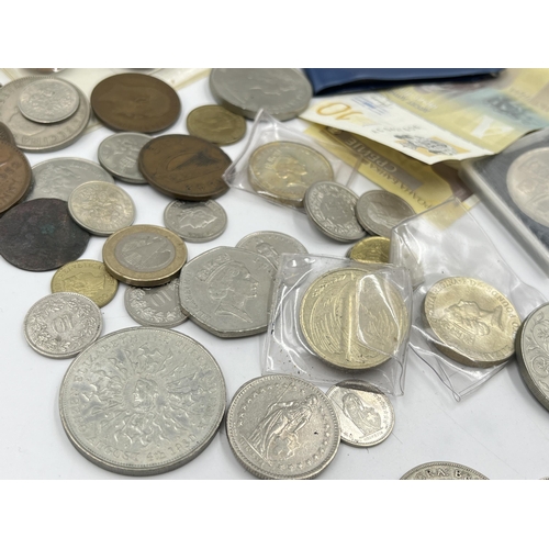 A collection of banknotes and coins to include 92.5% 1889 silver ...