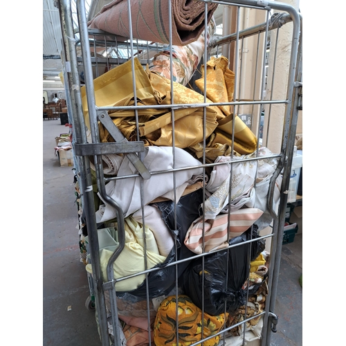 Two cages containing an extremely large quantity of vintage fabrics ...