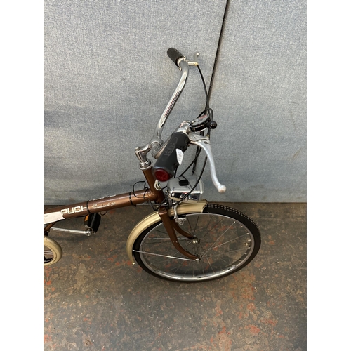Two items, one vintage Puch Promenade 20 bike together with a ...