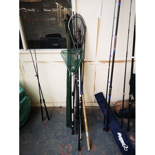A collection of fishing rods and nets to include Shakespeare carp rods ...