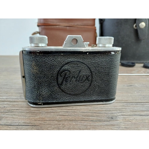 Two cased items, one Neidig Perlux 35mm camera fitted with Staeble ...