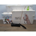 A boxed Nintendo Wii console with boxed Wii Fit unit, Wii Motion Plus ...