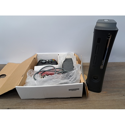 A collection of Microsoft Xbox 360 items to include two consoles - one ...