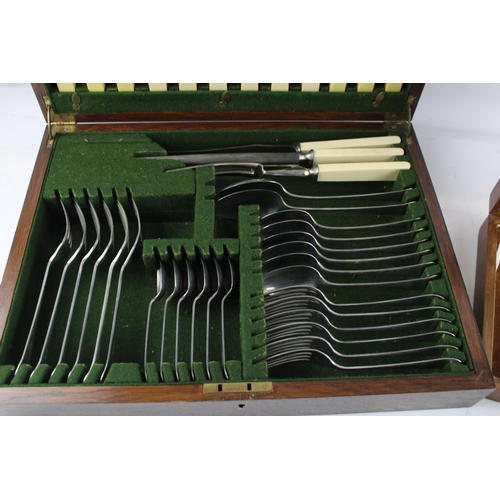 Two early 20th century cased cutlery sets