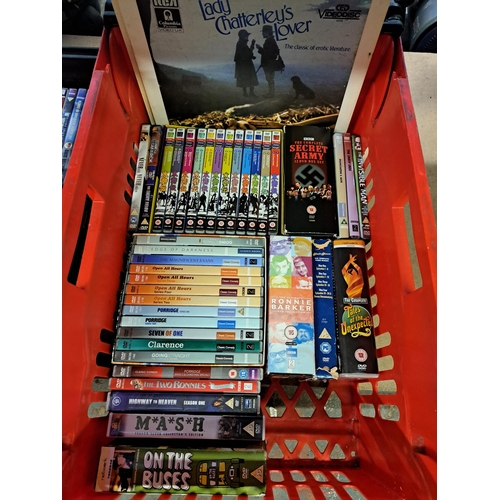 Three boxes and a bag containing a large quantity of mixed media; DVDs ...