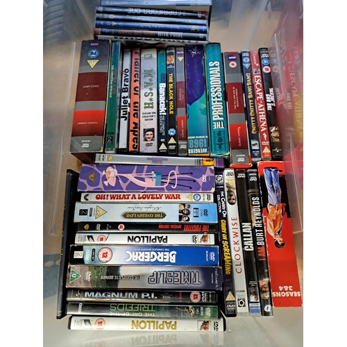 Three boxes and a bag containing a large quantity of mixed media; DVDs ...