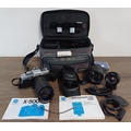 A Fotima camera case containing Minolta X-500 35mm SLR camera fitted with Tokina 1:4-4.5 35-135mm le