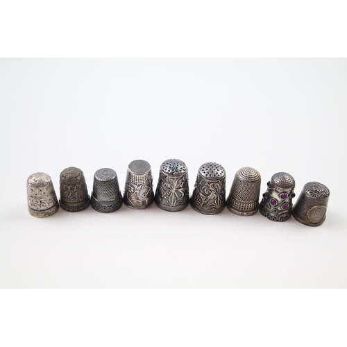 Nine .925 sterling silver thimbles to include Charles Horner etc ...