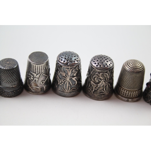 Nine .925 sterling silver thimbles to include Charles Horner etc ...