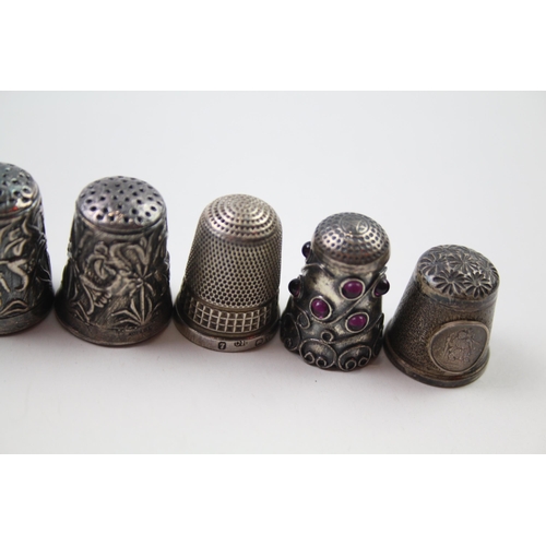Nine .925 sterling silver thimbles to include Charles Horner etc ...