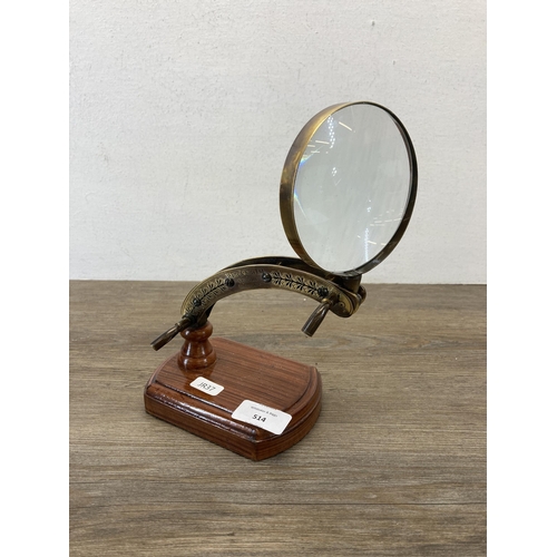 A 19th century style brass desk top optician's magnifying glass stamped ...