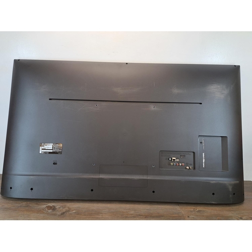 An LG 55UJ630V 55" 4K LED smart TV with remote control