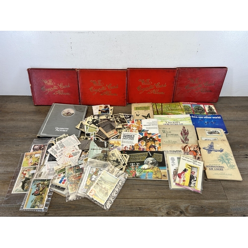 A large collection of vintage picture cards and picture card albums