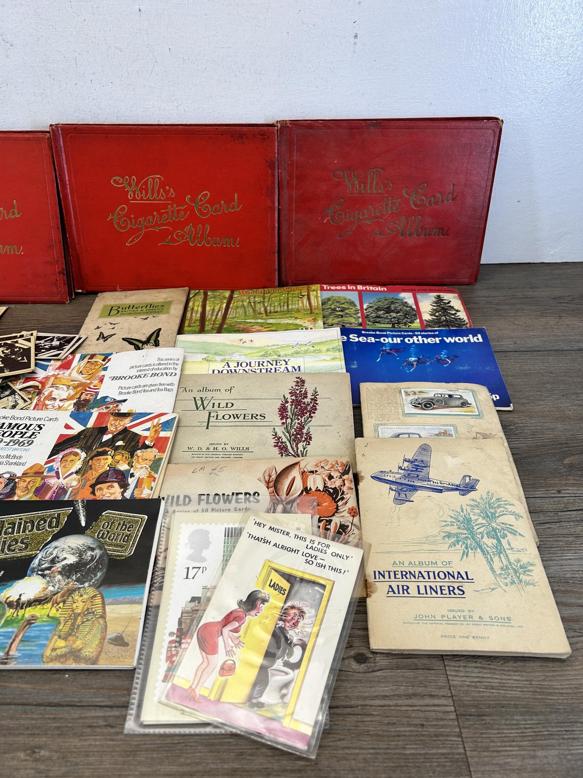 A large collection of vintage picture cards and picture card albums
