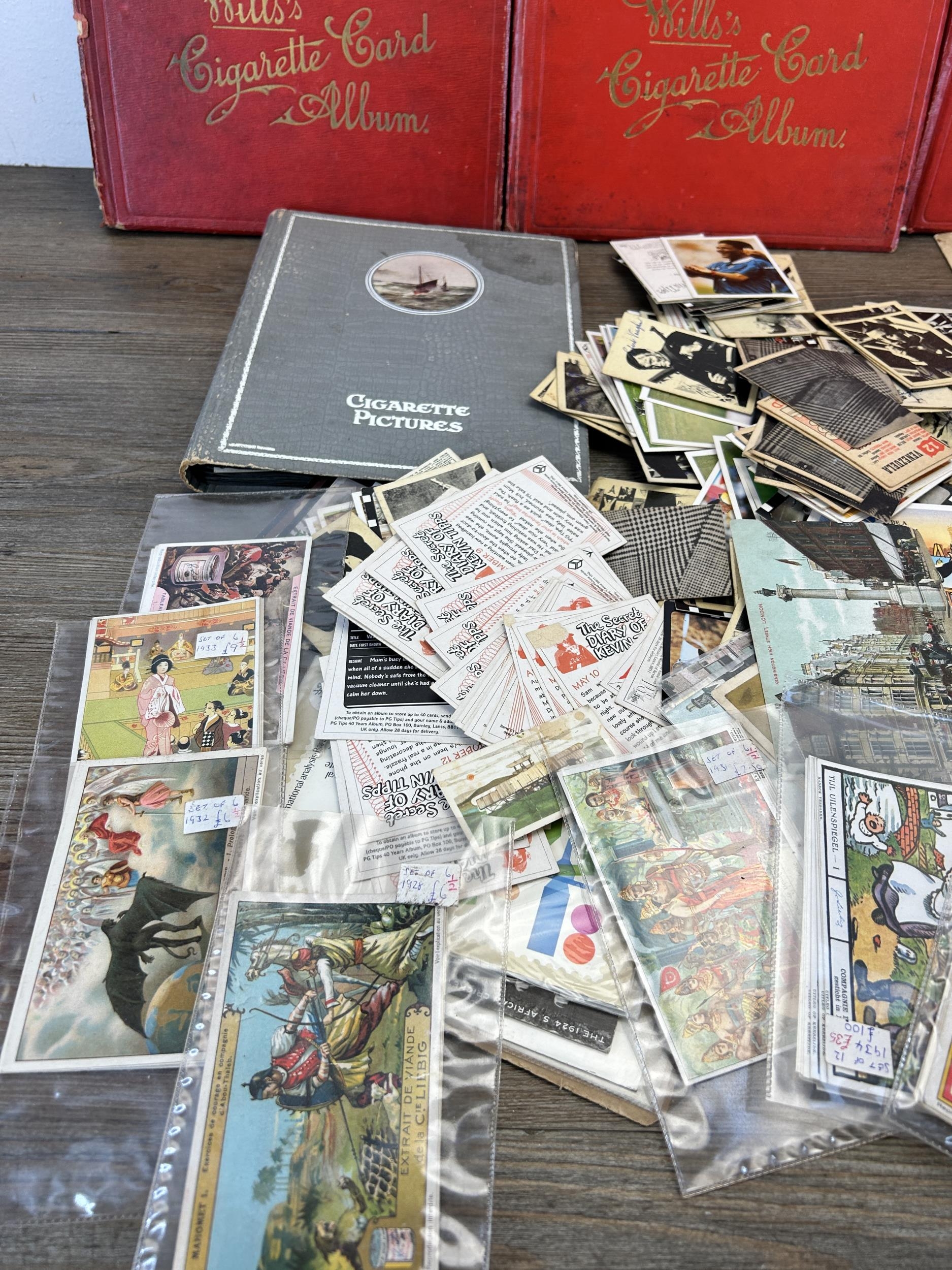 A large collection of vintage picture cards and picture card albums