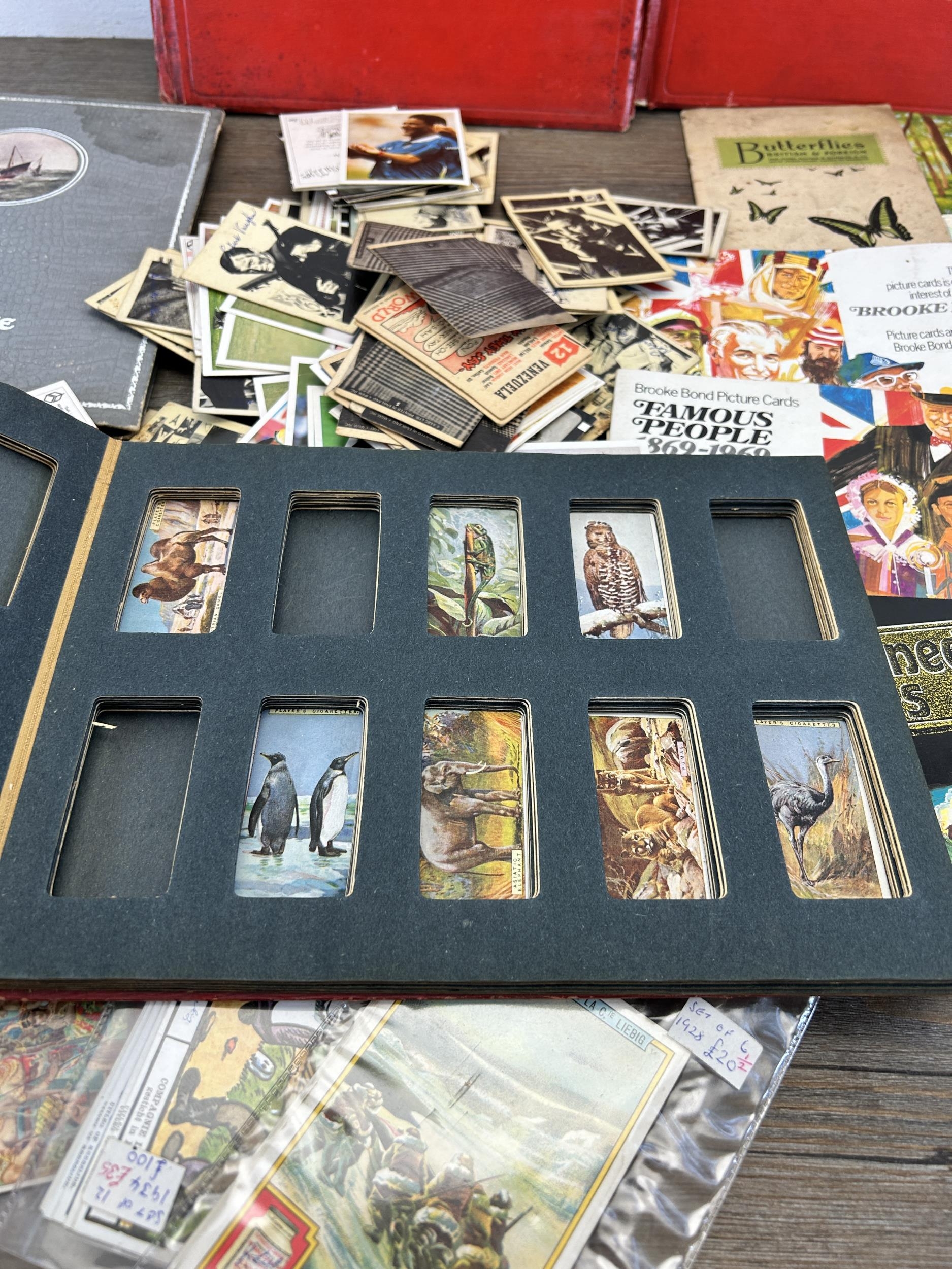 A large collection of vintage picture cards and picture card albums