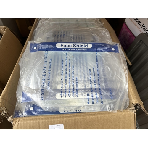 Eight boxes containing a large collection of face shields and ...