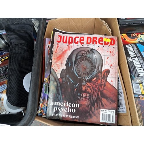 Seven boxes containing a large quantity of DVDs, Judge Dread comics ...