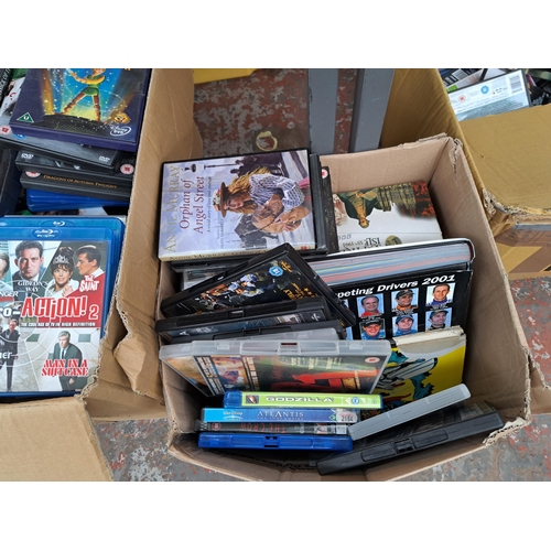 Seven boxes containing a large quantity of DVDs, Judge Dread comics, electricals, boxed vintage cutl