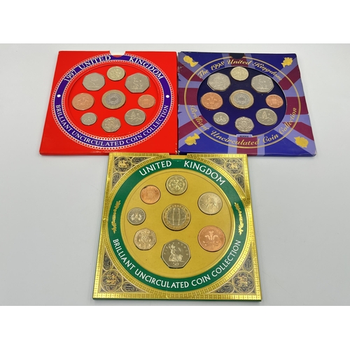 Three packaged United Kingdom brilliant uncirculated coin sets, 1997 ...