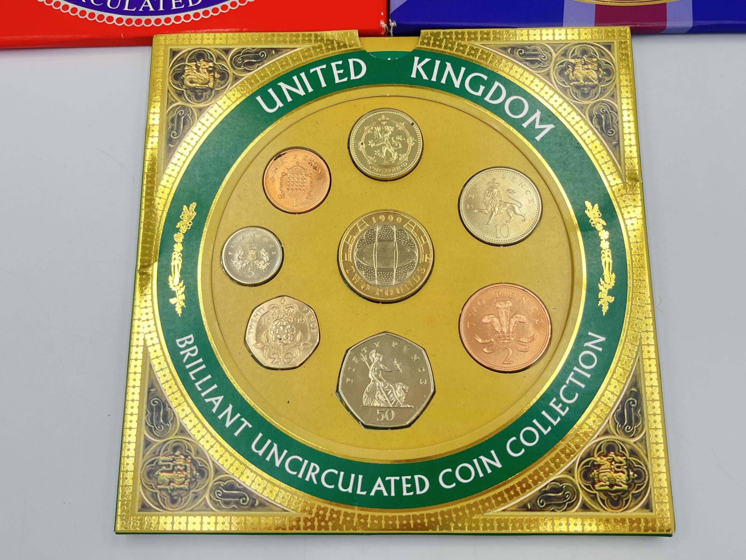 Three packaged United Kingdom brilliant uncirculated coin sets, 1997 ...