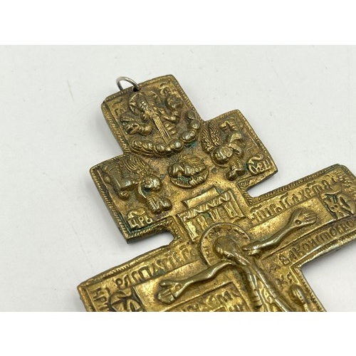 An antique Russian Orthodox brass wall cross - approx. 11cm high x 6cm wide