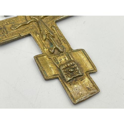 An antique Russian Orthodox brass wall cross - approx. 11cm high x 6cm wide