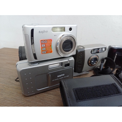 A collection of digital cameras to include HP, Hitachi, Sanyo, Agfa ...