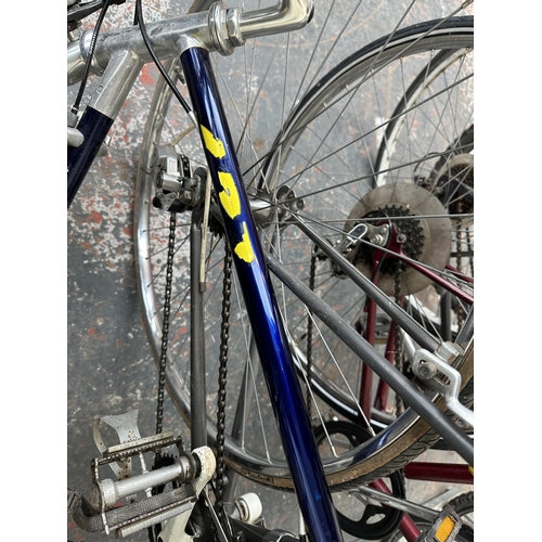 Two road bikes, one Vitus 797 and one other with Shimano Deore gear system
