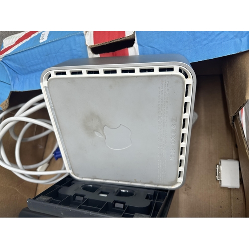 An Apple Mac Mini A1176 with Apple wireless keyboard and mouse
