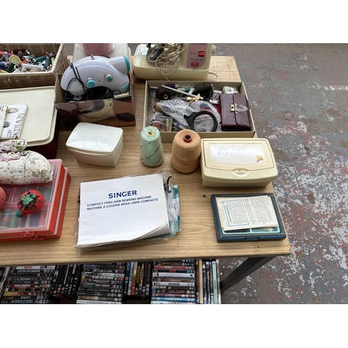A collection of sewing items to include Singer Featherweight 100 ...
