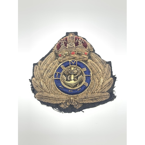 A collection of militaria to include buttons, British Merchant Navy ...