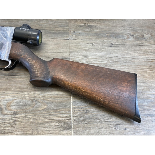 An "Original" model 50 .22 underlever air rifle with Bushnell 3-9x40 ...