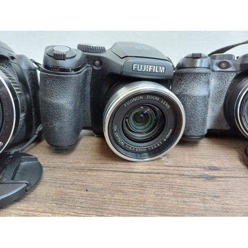 Five Fujifilm FinePix compact digital bridge cameras, S8650 16mp, S4000 ...
