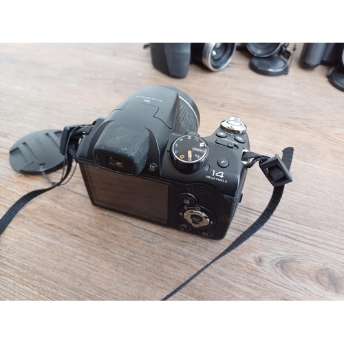 Five Fujifilm FinePix compact digital bridge cameras, S8650 16mp, S4000 ...