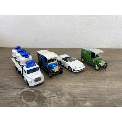 A collection of diecast model vehicles to include Saico 1/32 Ford Anglia, Saico 1/32 Ford Anglia Pol