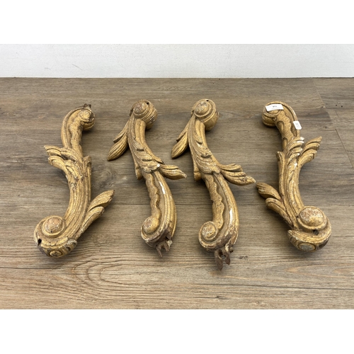 A set of four 19th century Rococo style carved wood and gilded brackets ...