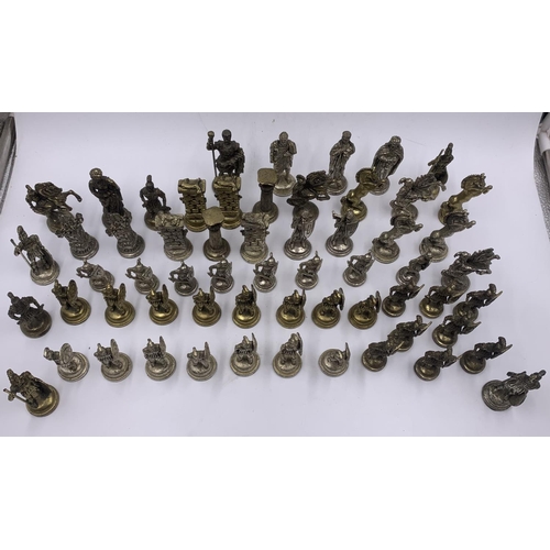 A collection of cast metal chess pieces