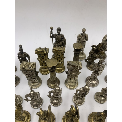 A collection of cast metal chess pieces
