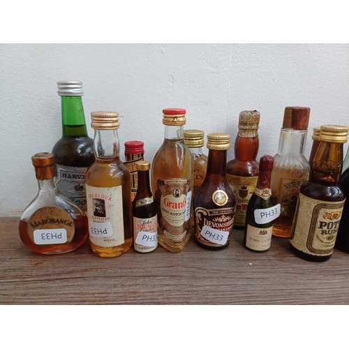 A collection of alcohol miniatures to include Abelour Grant's, Bell's ...