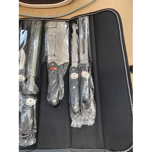 A cased Prima Profiline eight piece chef's knife and carving set