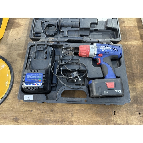 Two items, one Thorsman T18-C2 combi drill with battery and charger and ...