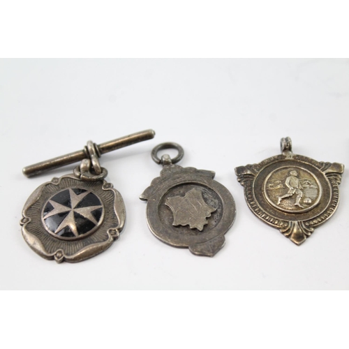 Five hallmarked sterling silver fobs and medallions - approx. gross ...