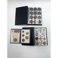 Two coin collection albums, one containing world coins to include 83.5% ...