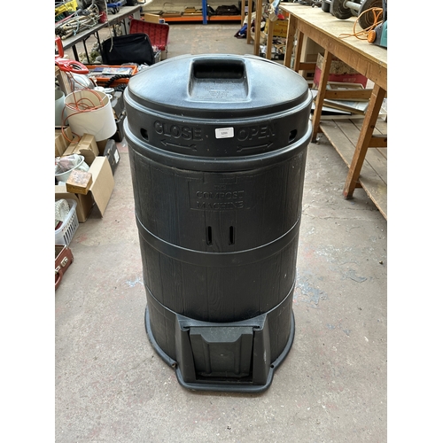 A black plastic compost bin - approx. 115cm high