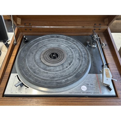A stereo system comprising Goldring Lenco GL75 four-speed transcription ...