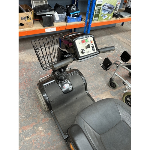 A Rascal 329LE mobility scooter with key - seen driven in