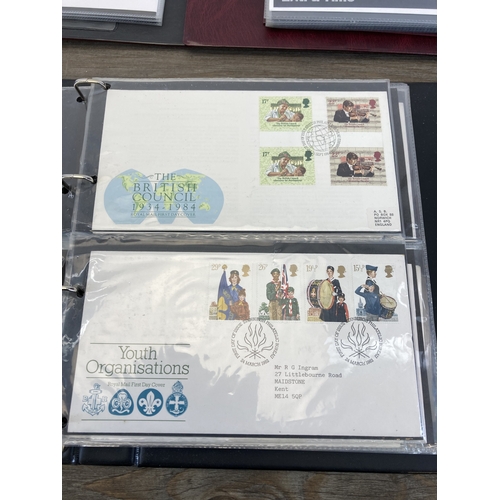 Three albums containing a collection of British first day covers and stamps